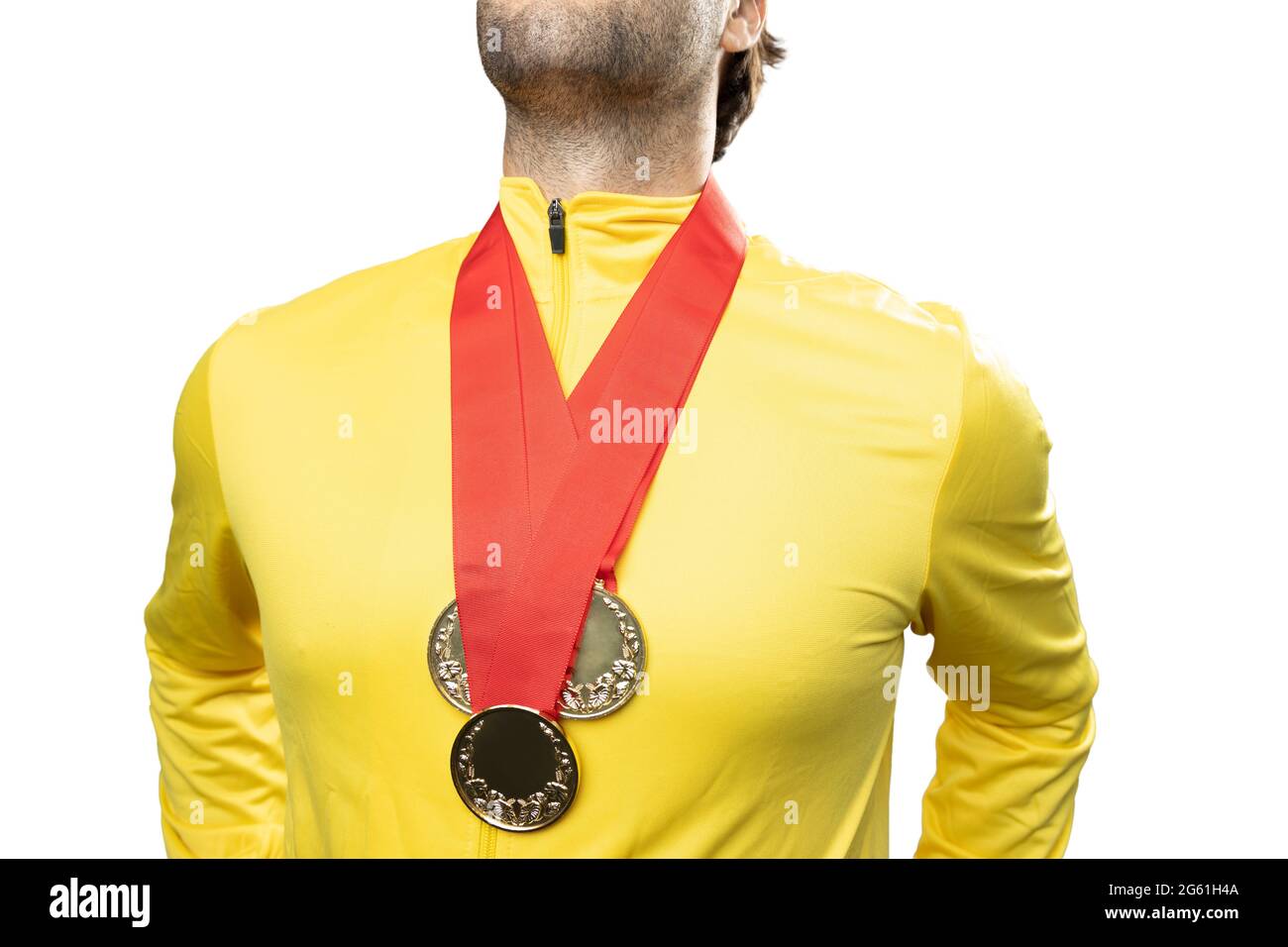 male athlete smiling after winning a gold medal in a white background ...