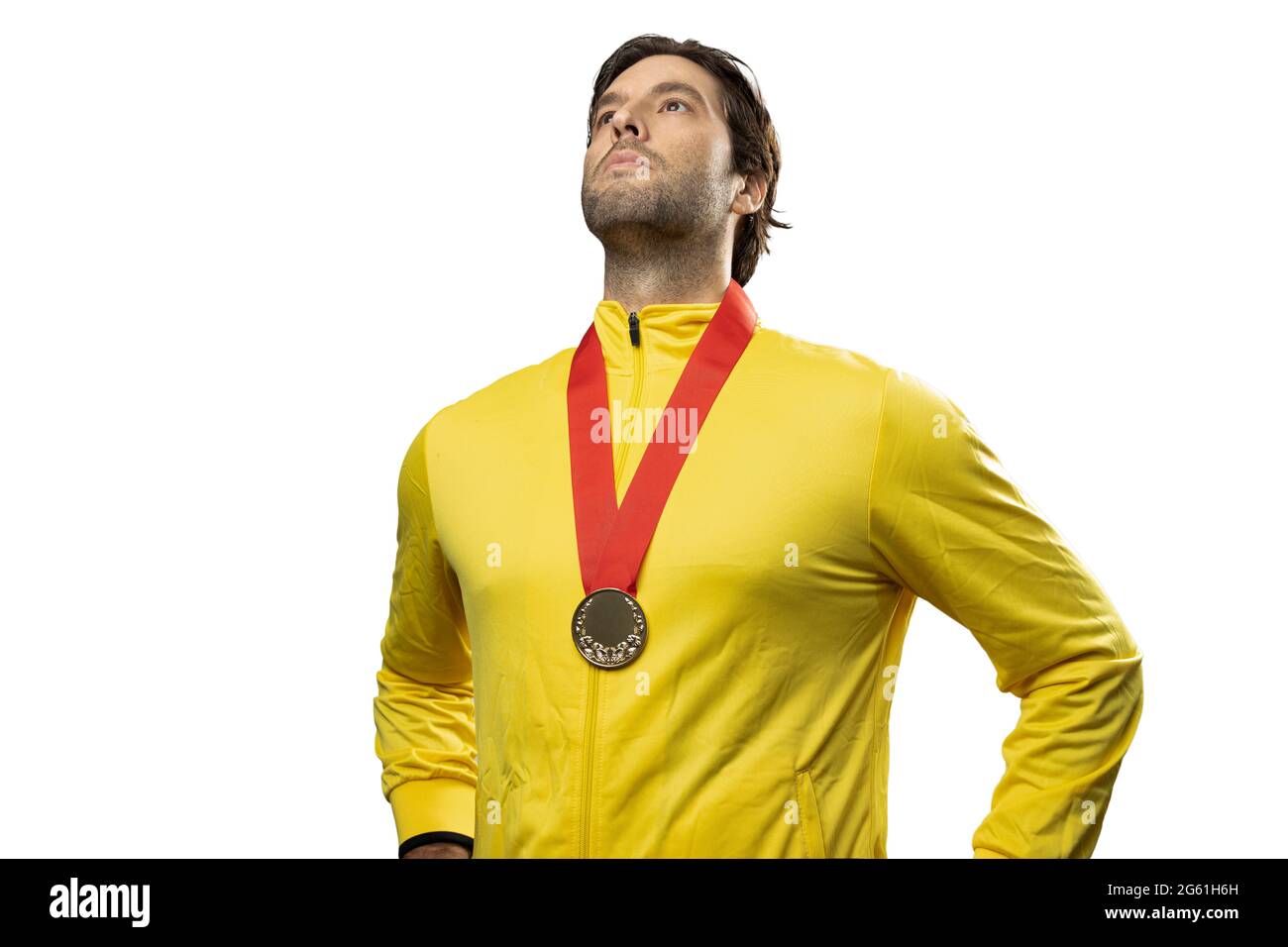 male athlete smiling after winning a gold medal in a white background ...