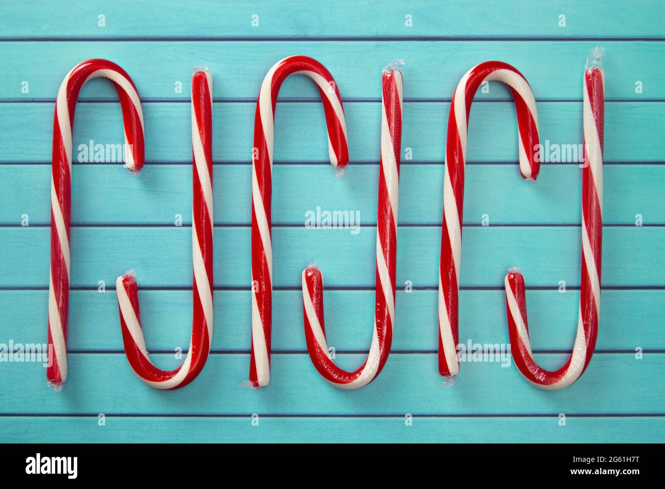 A Christmas Candy Cane Background with Traditional Colored Candy Canes ...