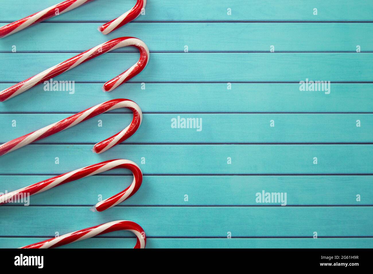 A Christmas Candy Cane Background with Traditional Colored Candy Canes ...