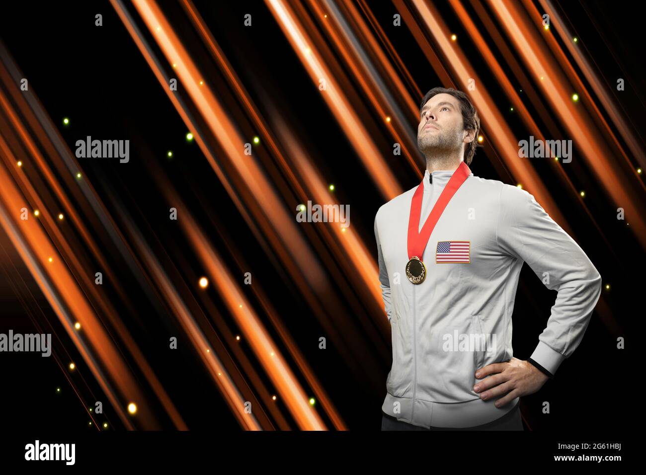 American male athlete smiling after winning a gold medal in a stadium ...