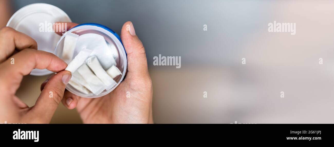 Woman Chewing Wet Moist Nicotine Tobacco Snus Product Stock Photo - Alamy