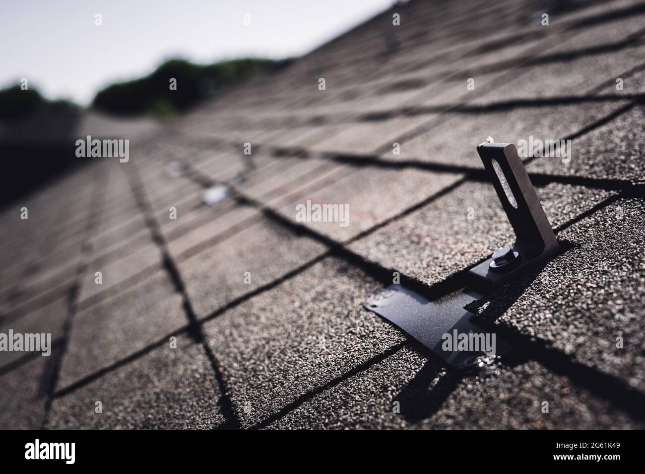 Residential asphalt shingle roof with metal anchors installed for the ...