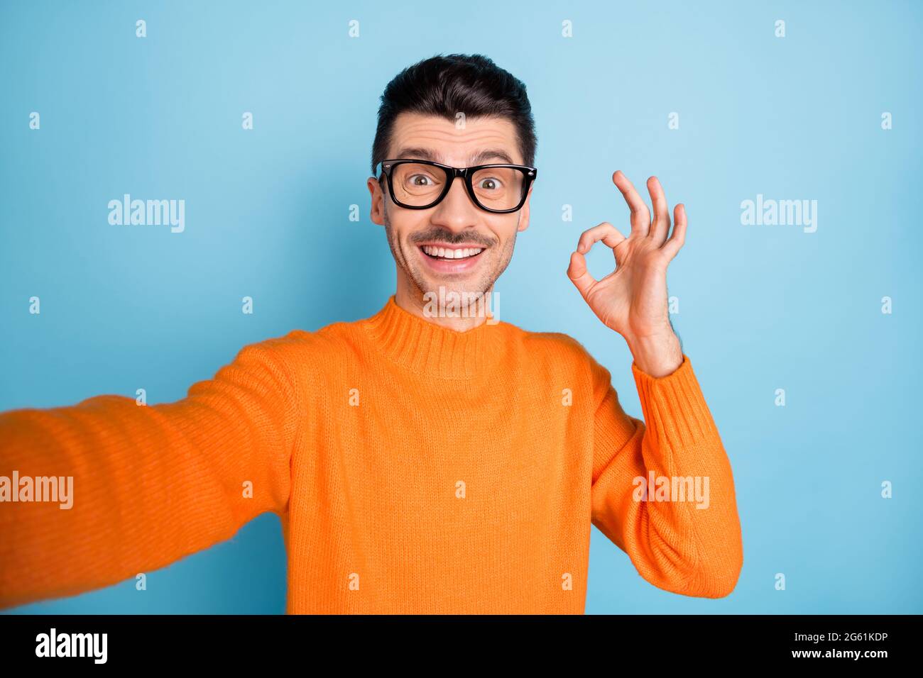 Photo of young man happy positive smile make selfie show okey sign cool ...