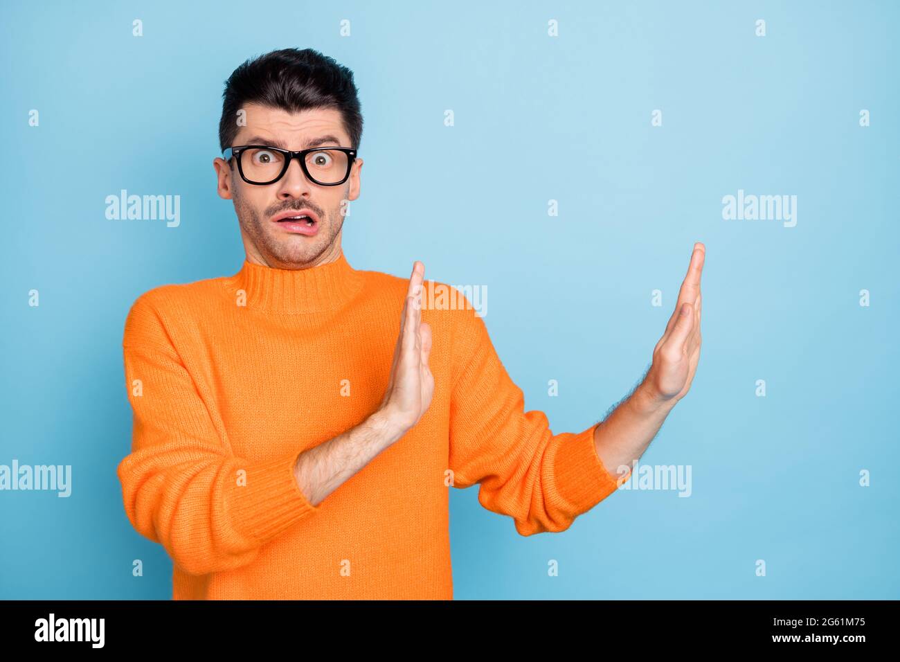 Photo of young man unhappy sad afraid scared nervous show no stop sign ...