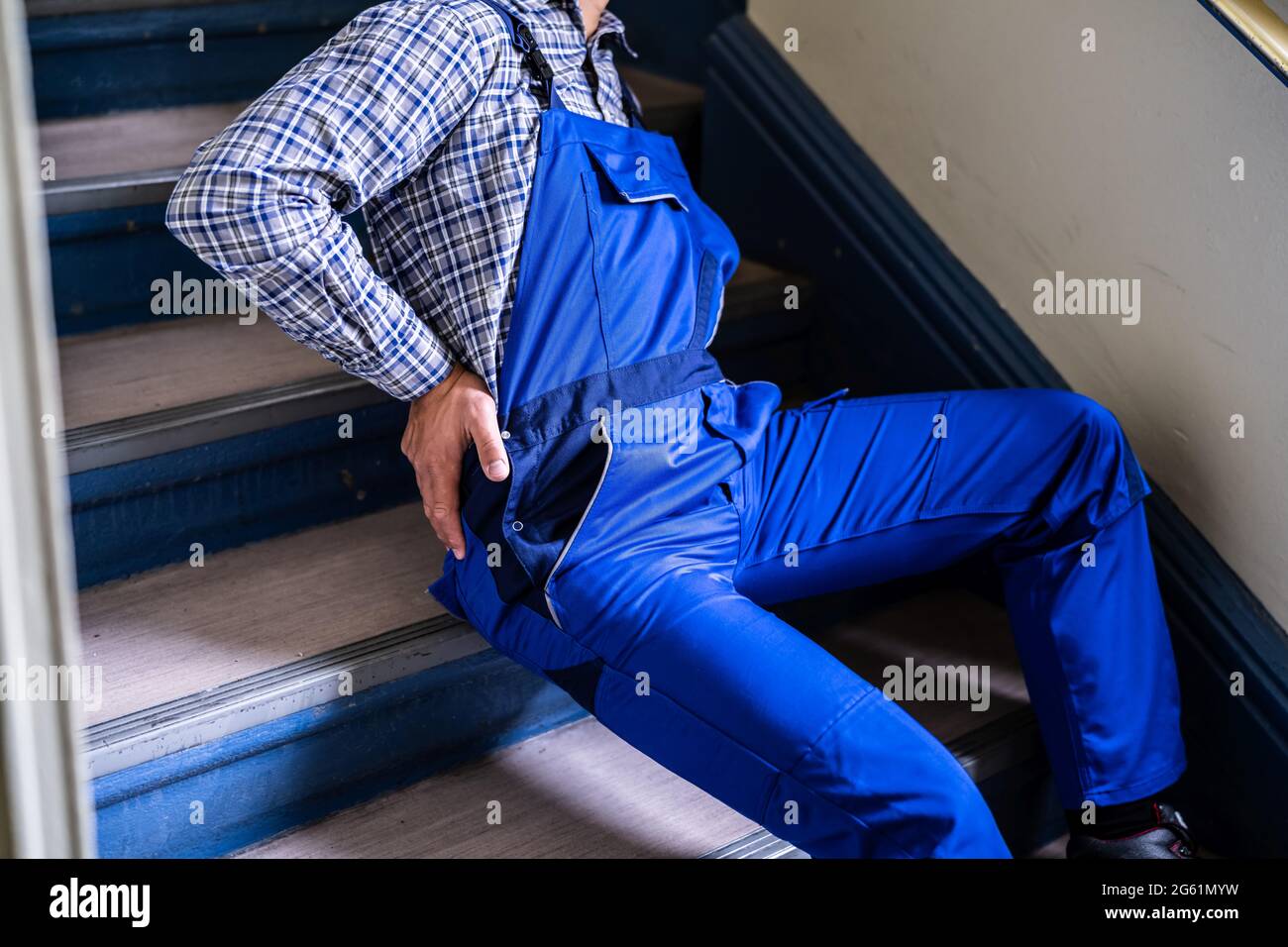Worker Man Lying On Staircase After Slip And Fall Accident Stock Photo ...