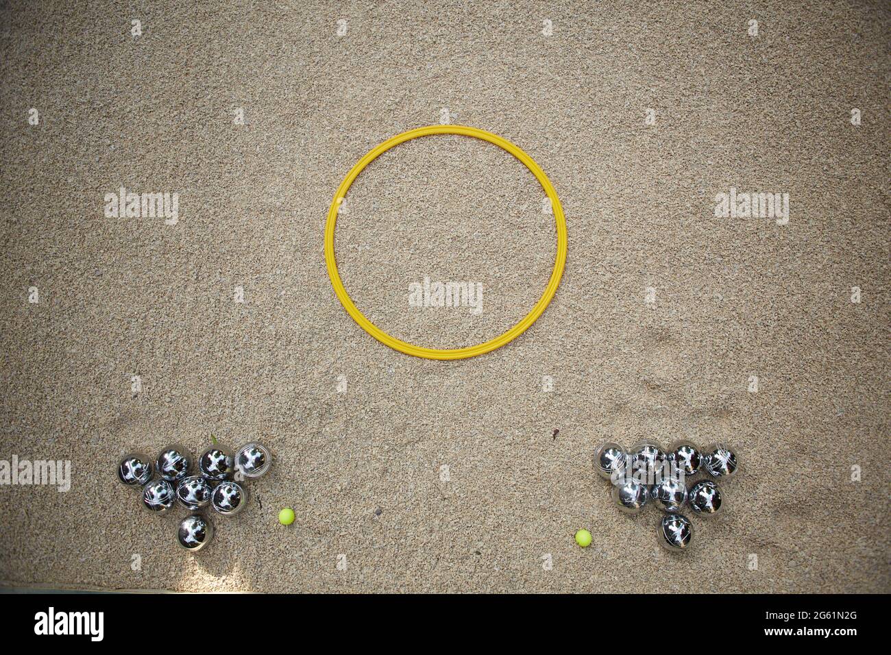 Petanque set with nineteen metal balls in field for game Stock Photo ...