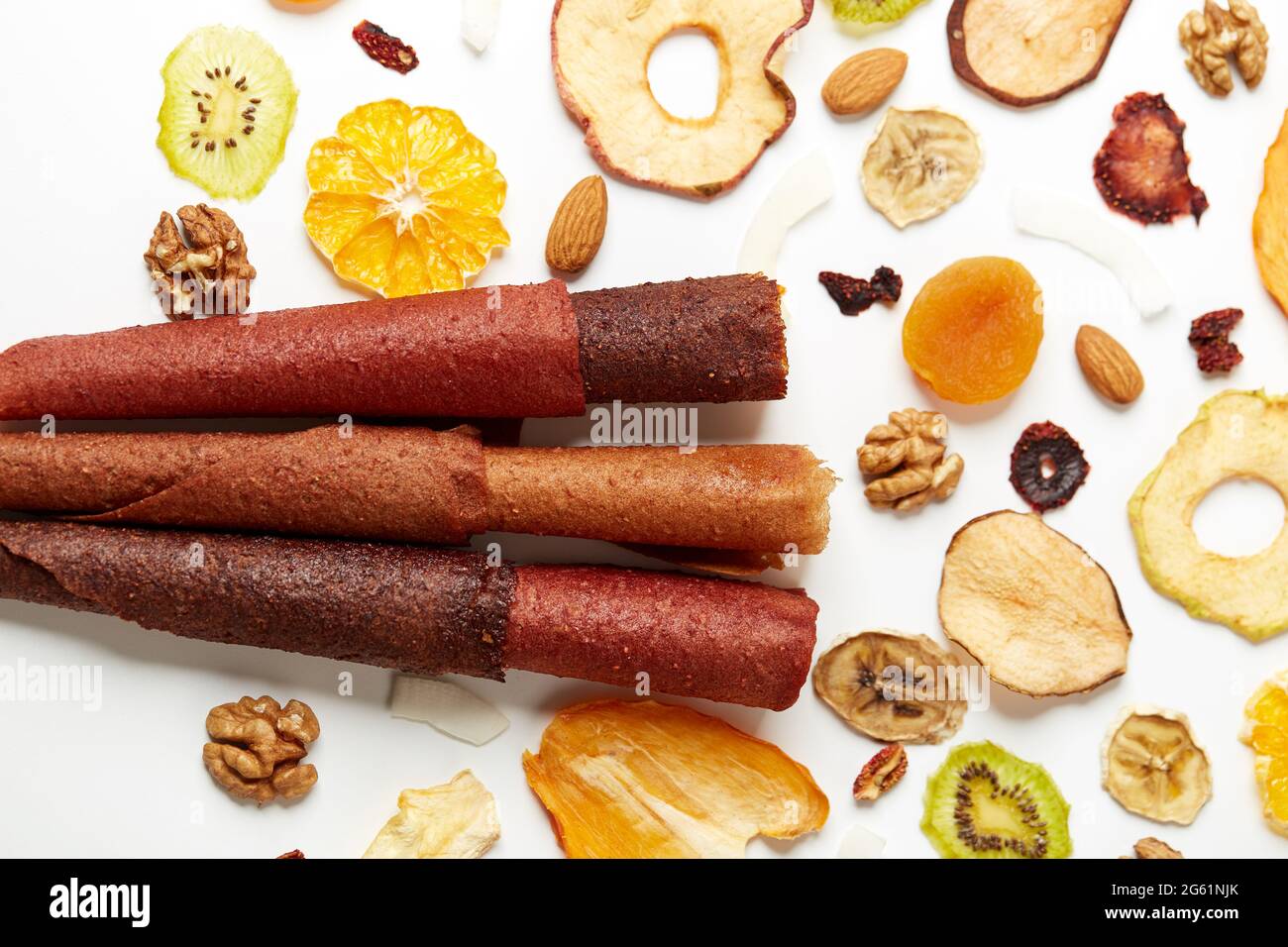 Above view of fruit lozenge different colors and almonds, orange, dried ...