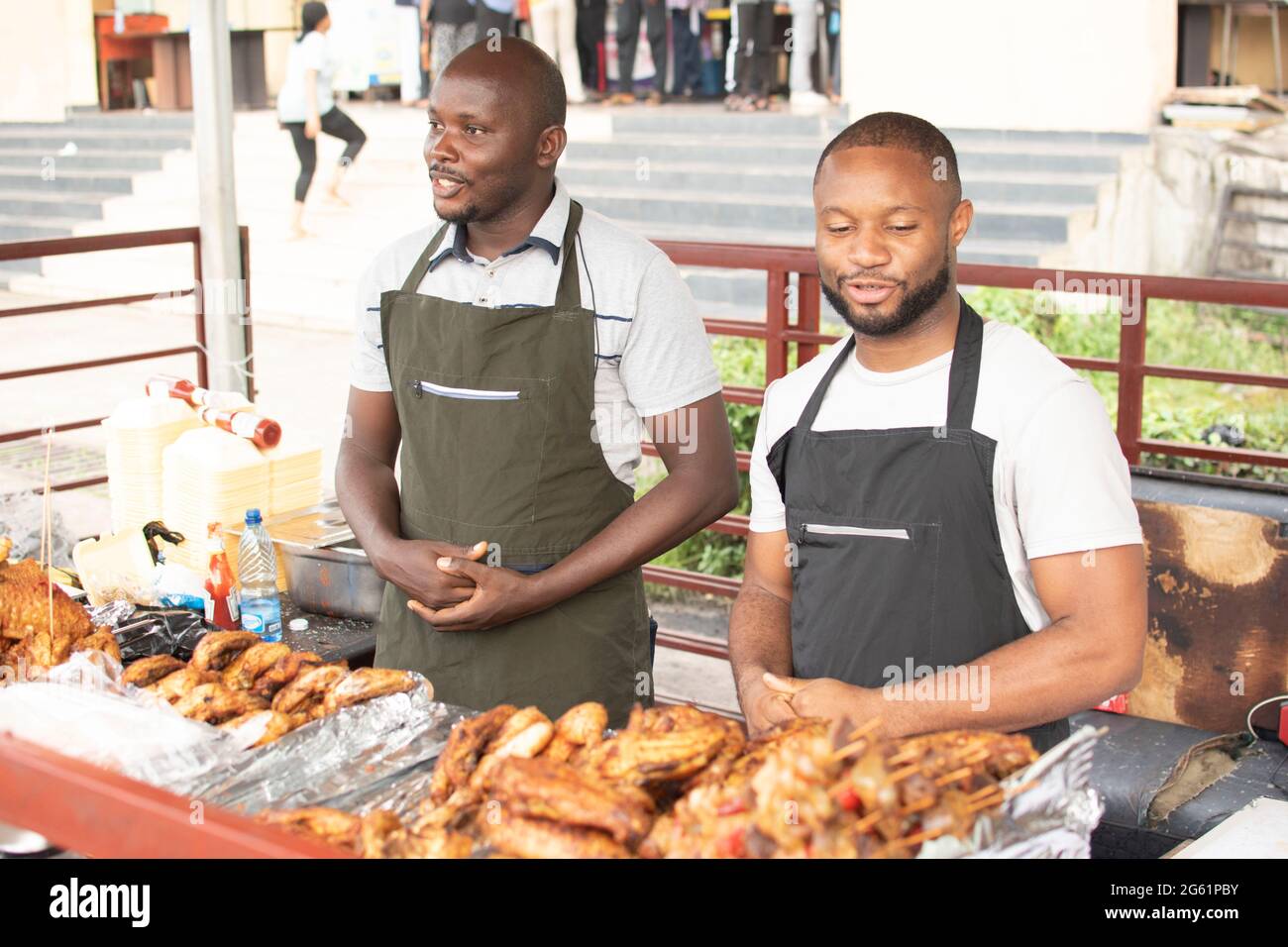 african men selling barbeque chicken Stock Photo - Alamy