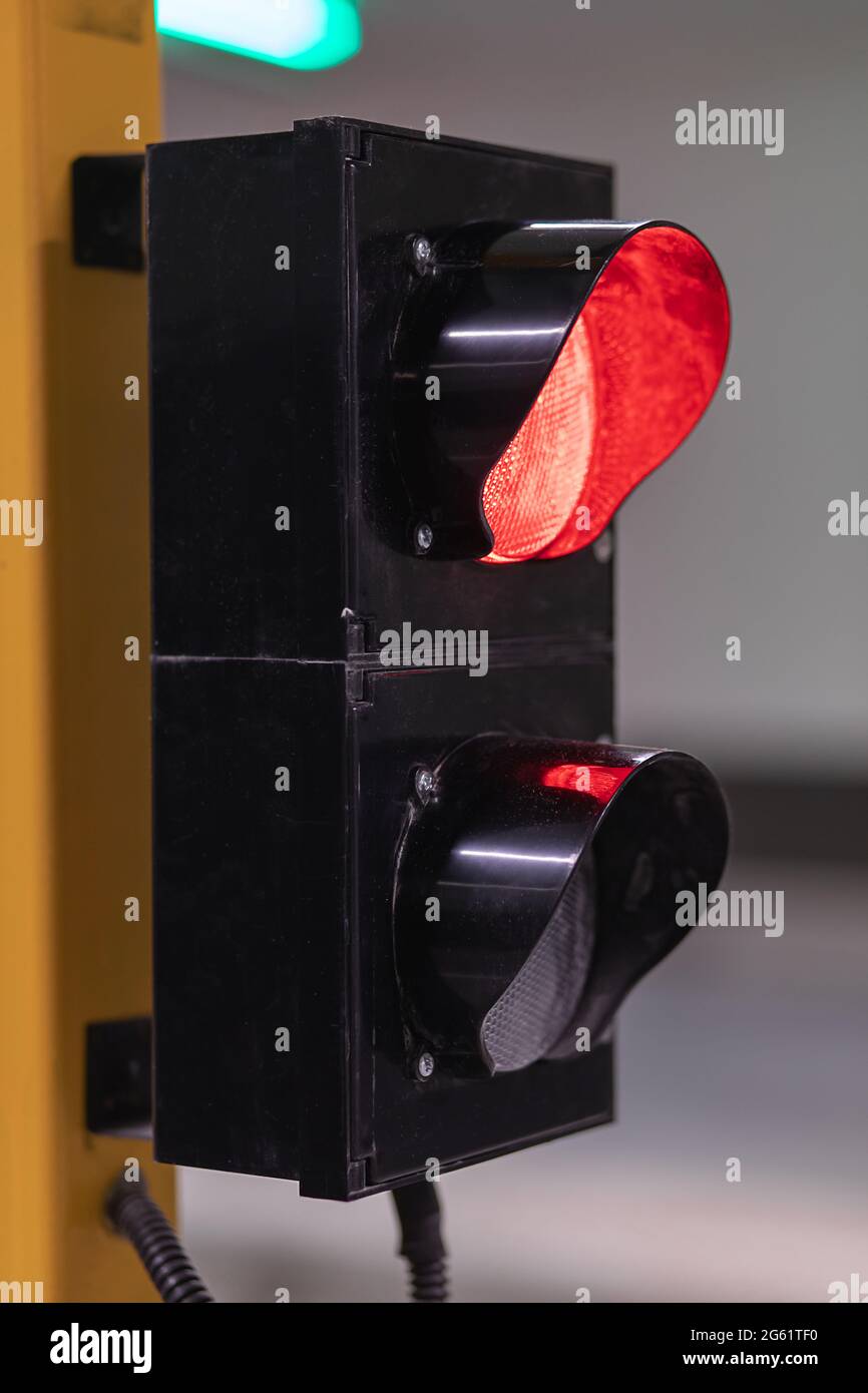 Vertical shot traffic lights closeup turn red when entering or exiting ...