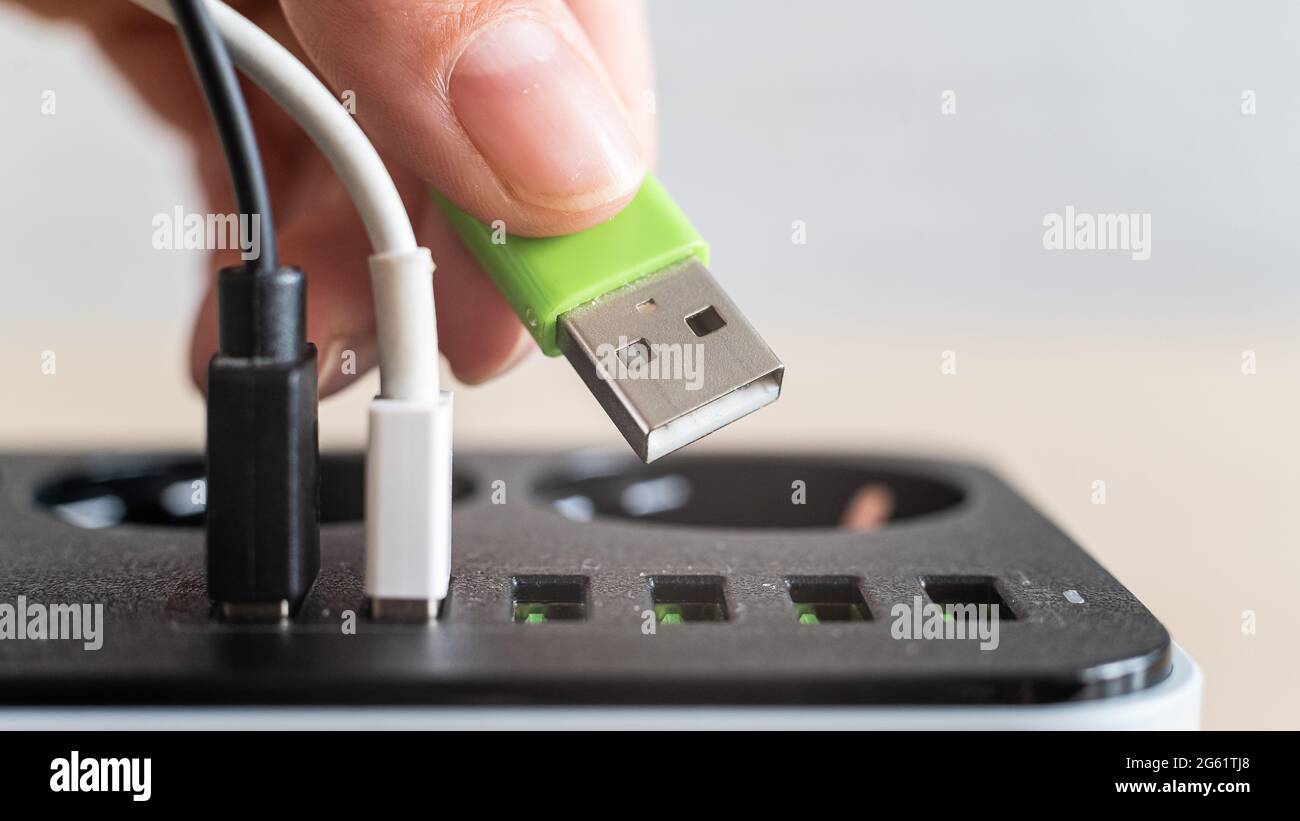 Modern convenient multi-port usb charger for devices. Close-up of a ... Modern convenient multi-port usb charger for devices. Close-up of a ...
