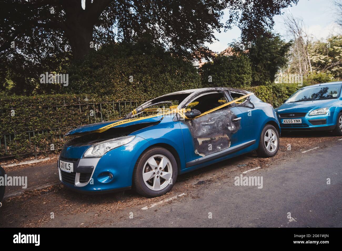 London | UK - 2021.06.12: An abandoned, stolen burnt out blue car ...