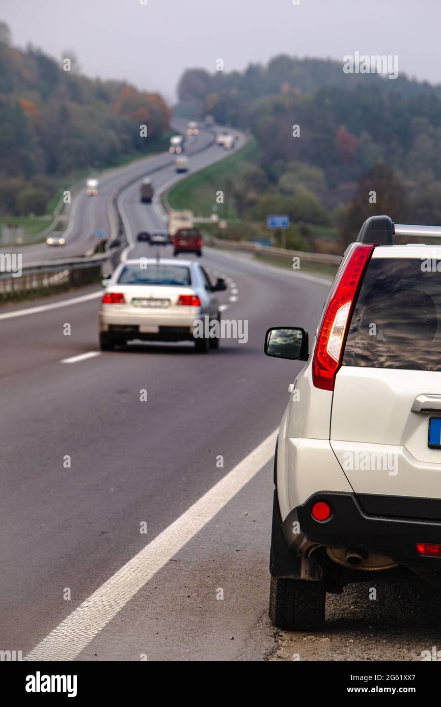 parked car on roadside of highway autumn season Stock Photo - Alamy