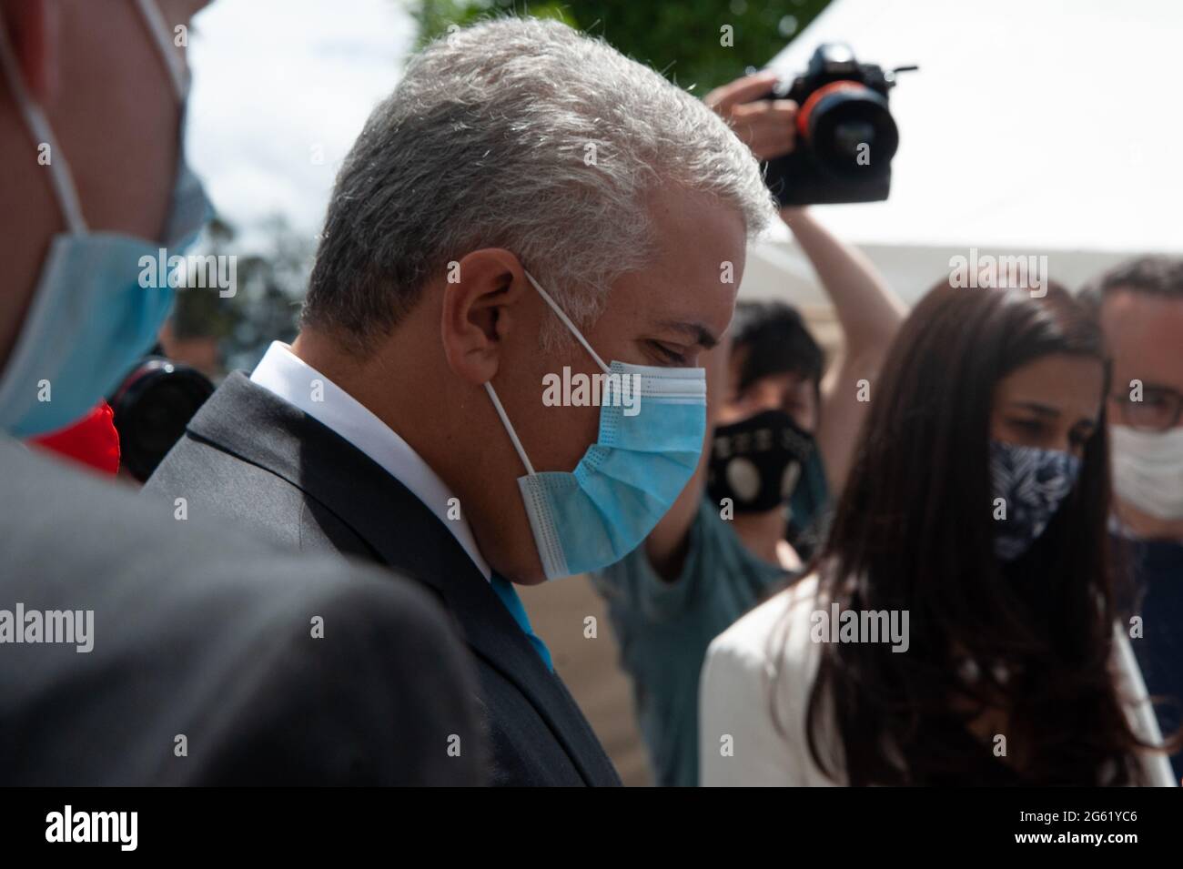 Colombia's president Ivan Duque stands and signs Colombia's national ...