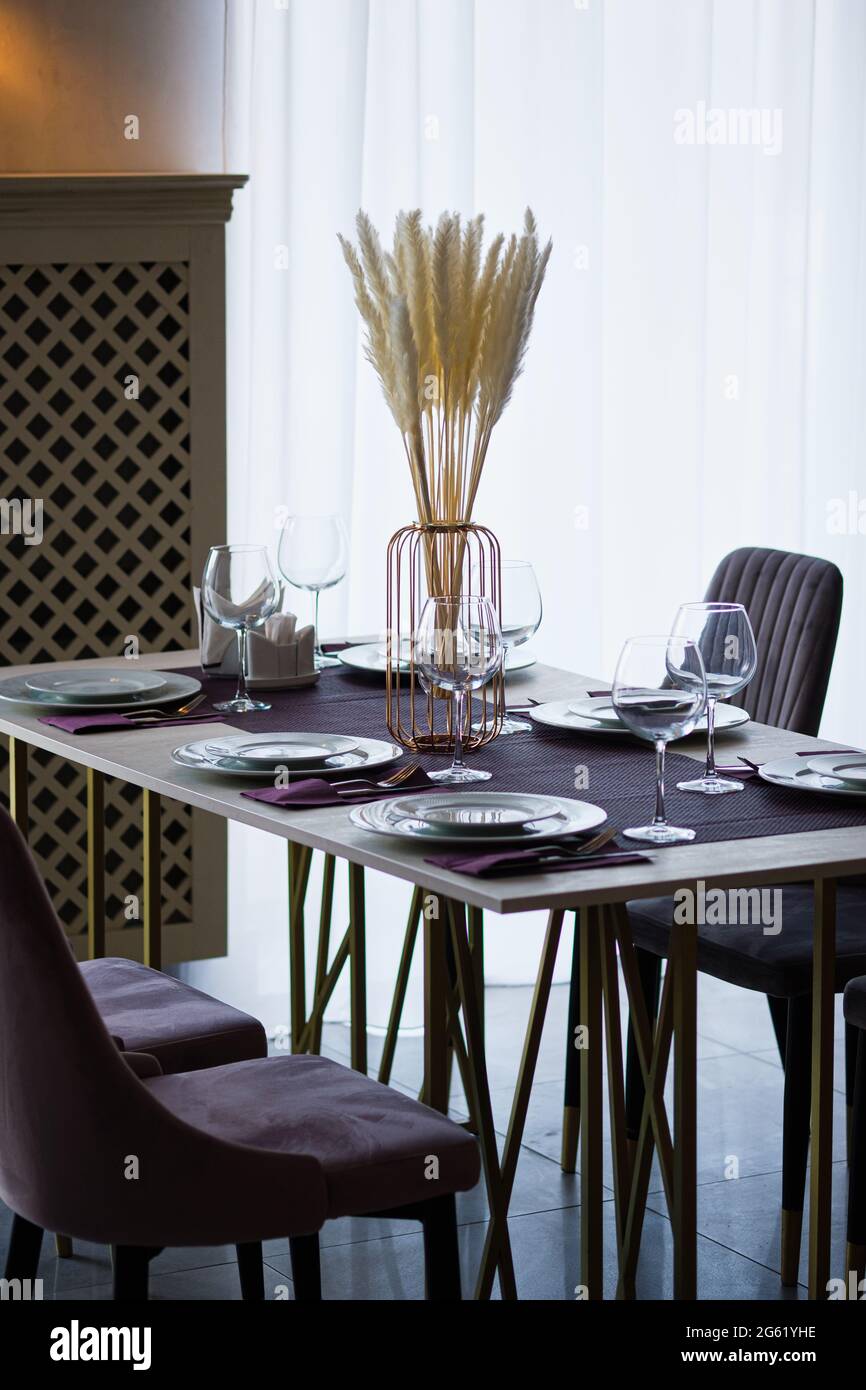 Table setting in the restaurant. Preparing the restaurant for receiving ...