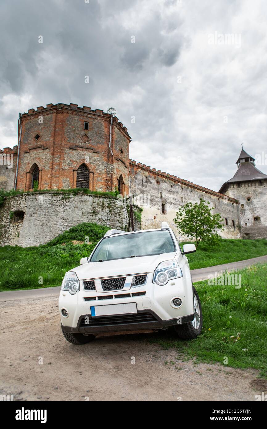 car travel concept suv in front of old castle copy space Stock Photo ...