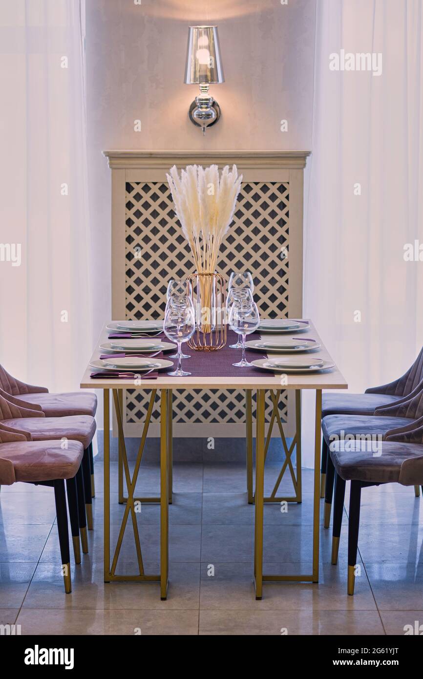 Table setting in the restaurant. Preparing the restaurant for receiving ...