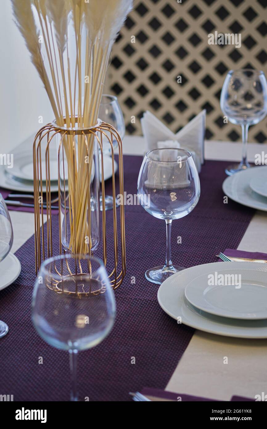 Table setting in the restaurant. Preparing the restaurant for receiving ...