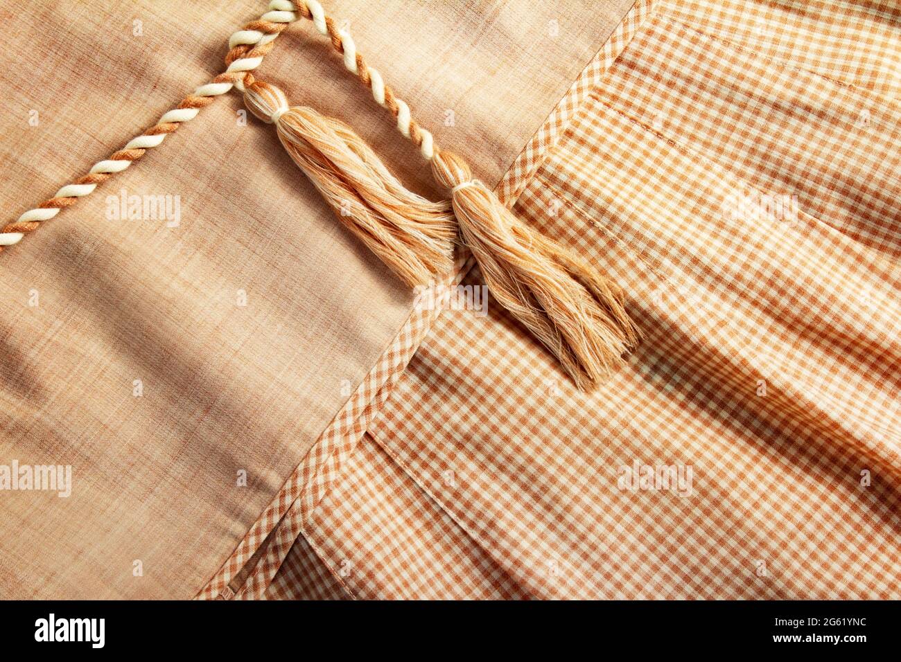 Close-up photo of linen cloth dress texture with lacing, edgiing and ...