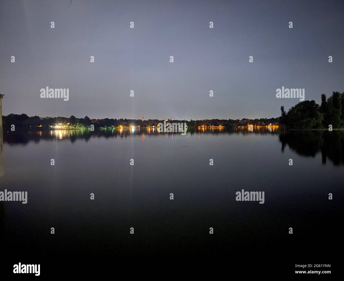 Lake night view with lights reflection on it Stock Photo - Alamy
