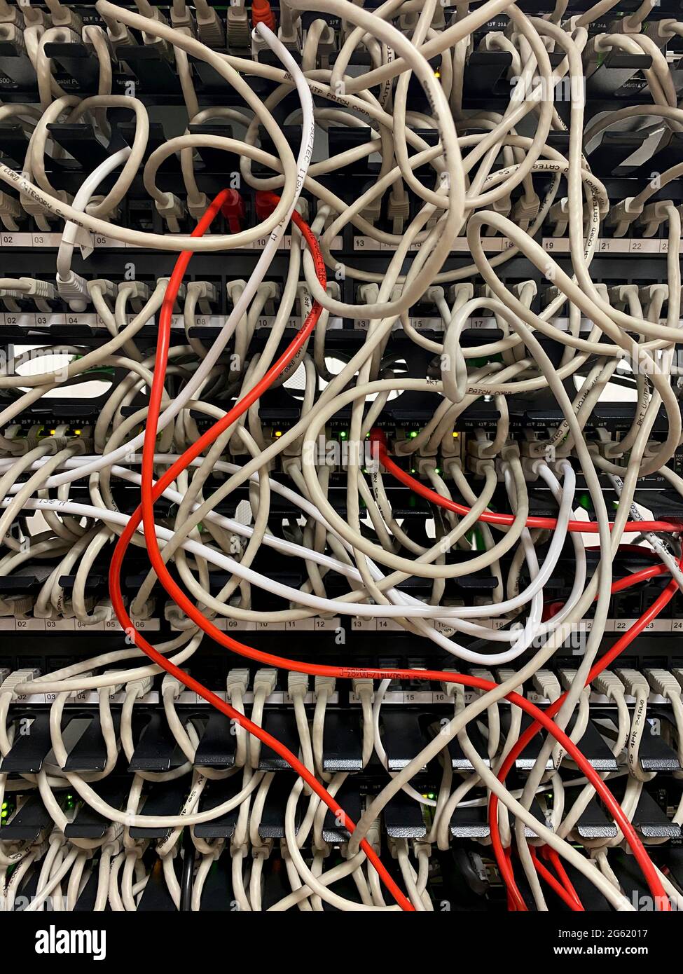 Internet cables rack not arranged in data center Stock Photo - Alamy