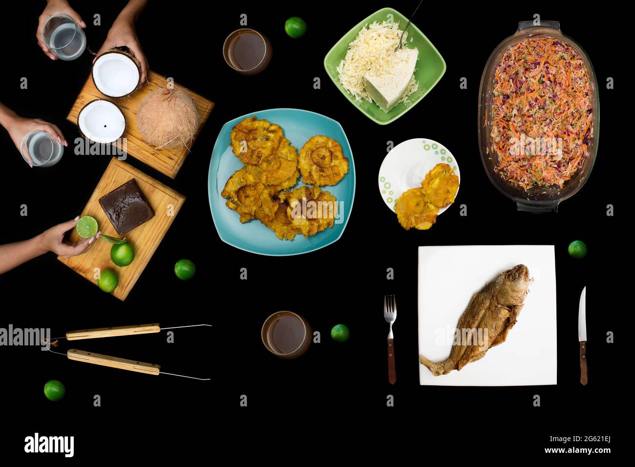 Fried fish with tostones and grated carrot salad, cabbage, lettuce ...