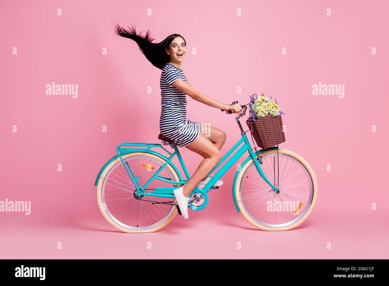 Full length body size profile side view of lovely cheerful girl riding ...