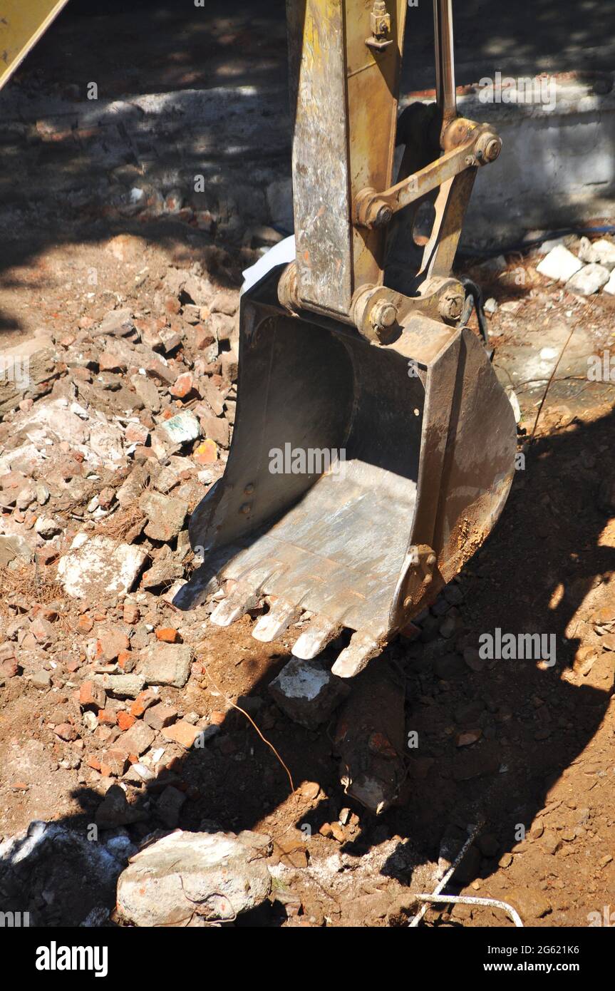 Excavator continues to work at the construction site, excavation site ...