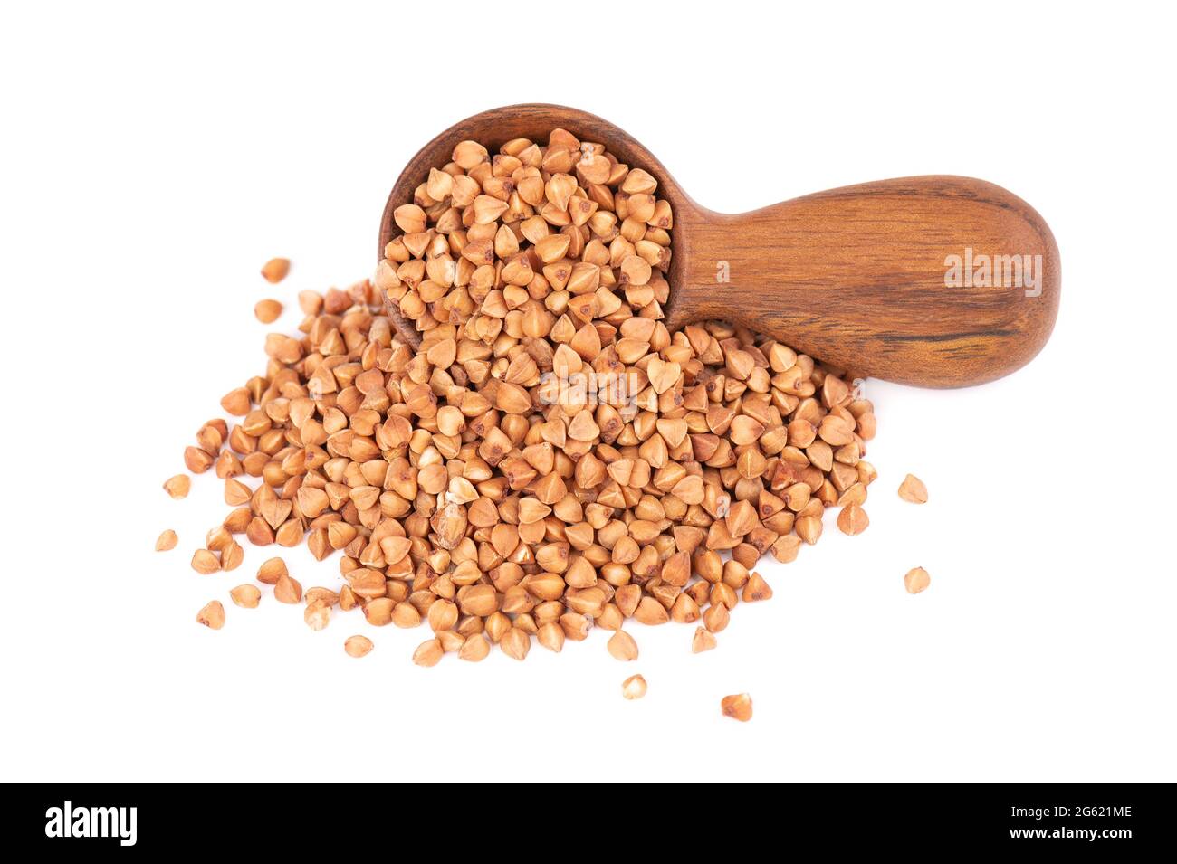 Roasted buckwheat grains in wooden spoon, isolated on white background ...