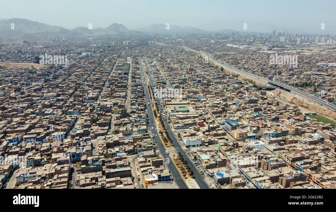 Aerial view of the district of San Martin de Porres and the Rimac river ...