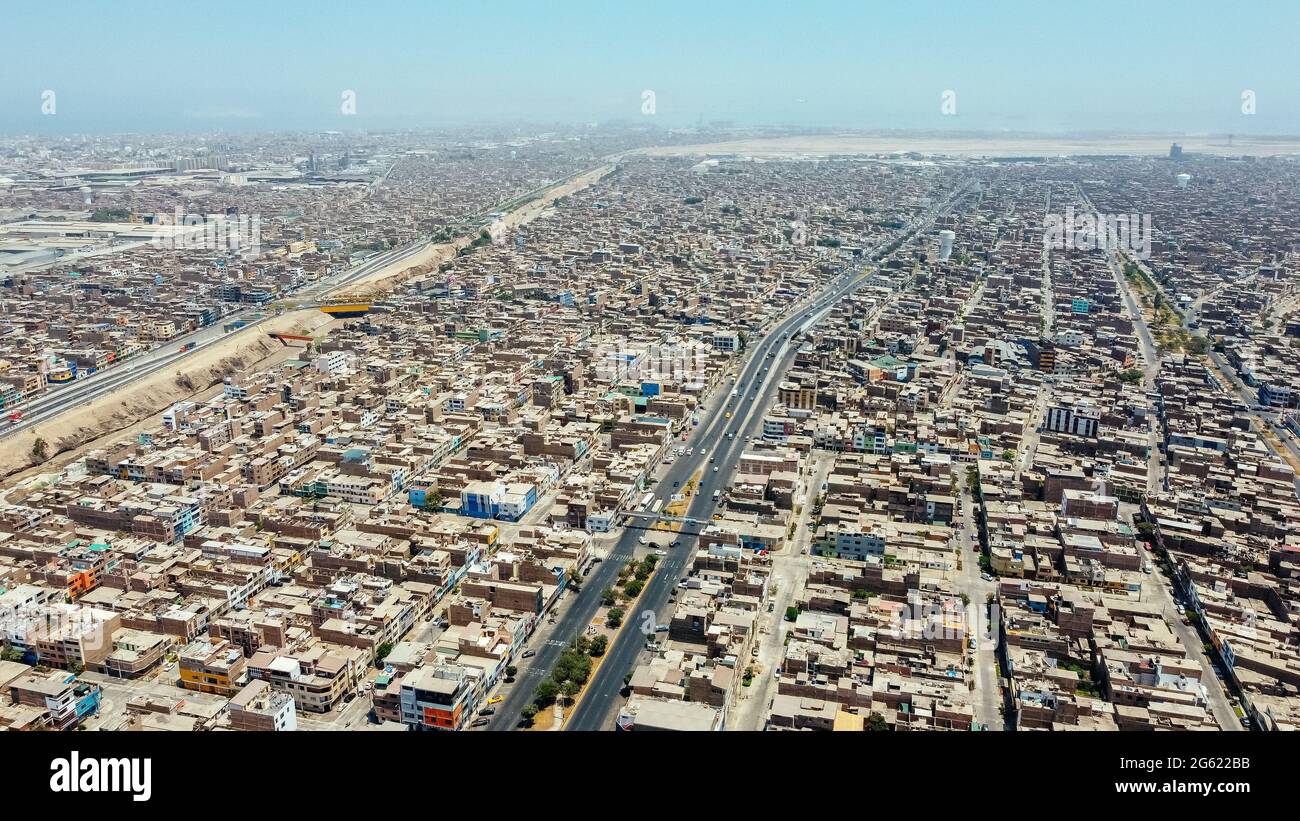 Aerial view of the district of San Martin de Porres and the Rimac river ...