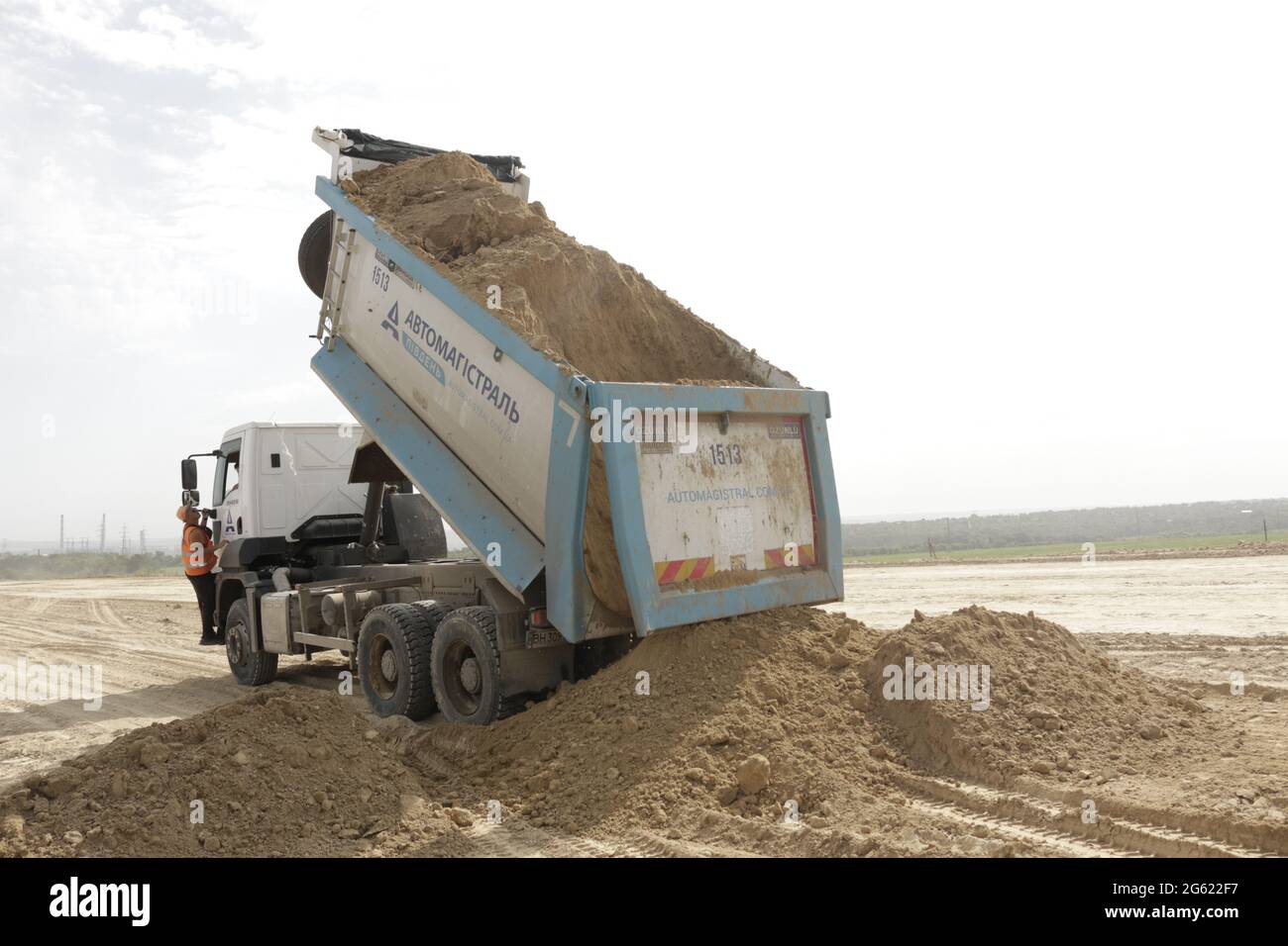 Dnepropetrovsk, Ukraine - 06.26.2021: Dump truck unloads clay soil for ...