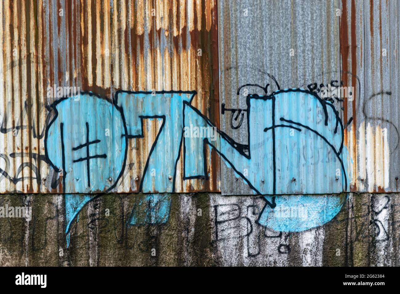 Graffiti painted on metal sheds in the railroad yard in Colegiales ...