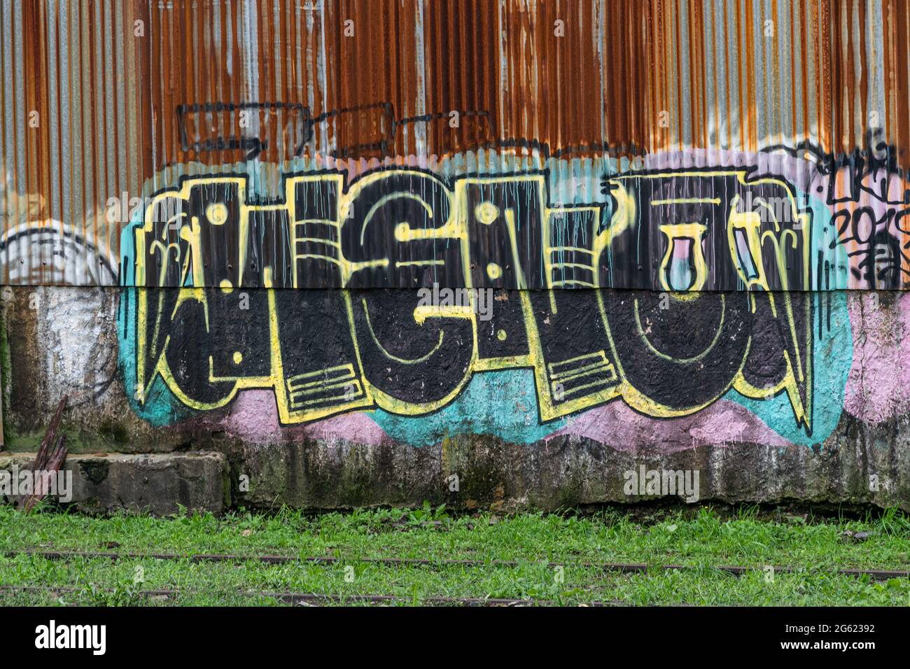 Graffiti painted on metal sheds in the railroad yard in Colegiales ...