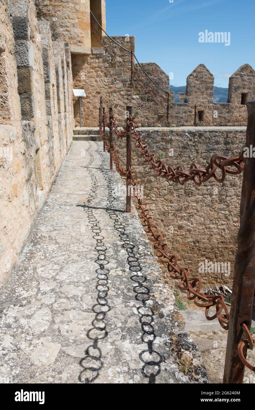 Frias castle tour with iron railings. Stone building with batlements ...