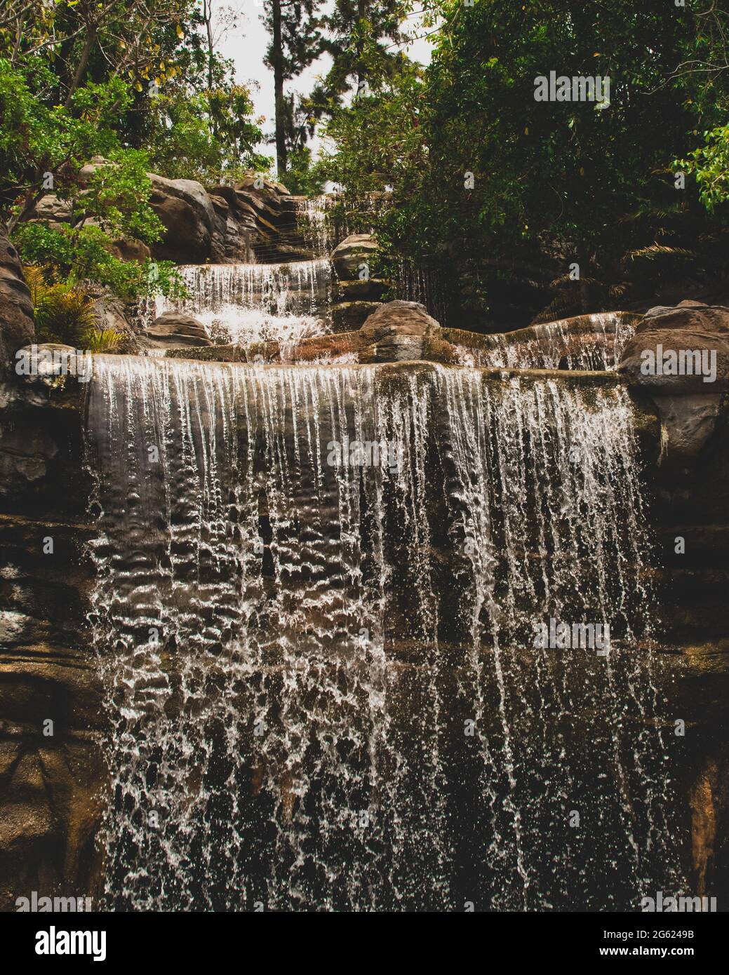 A peaceful waterfall in the woods Stock Photo - Alamy