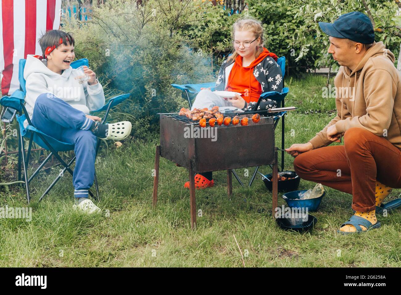 Girl barbecuing meat grill food roast hi-res stock photography and ...