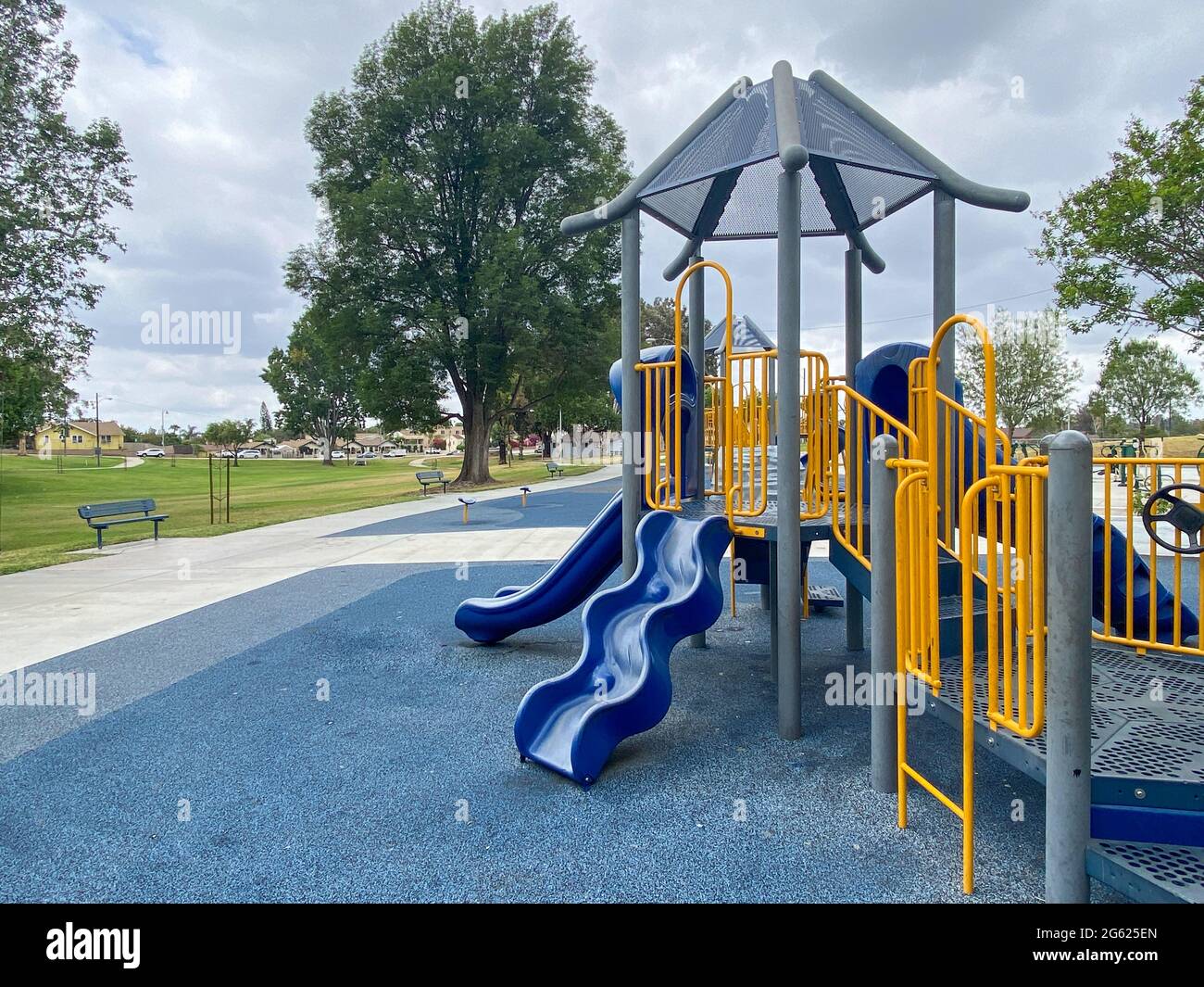 Children playground activities in public park. Slide, swing on modern ...