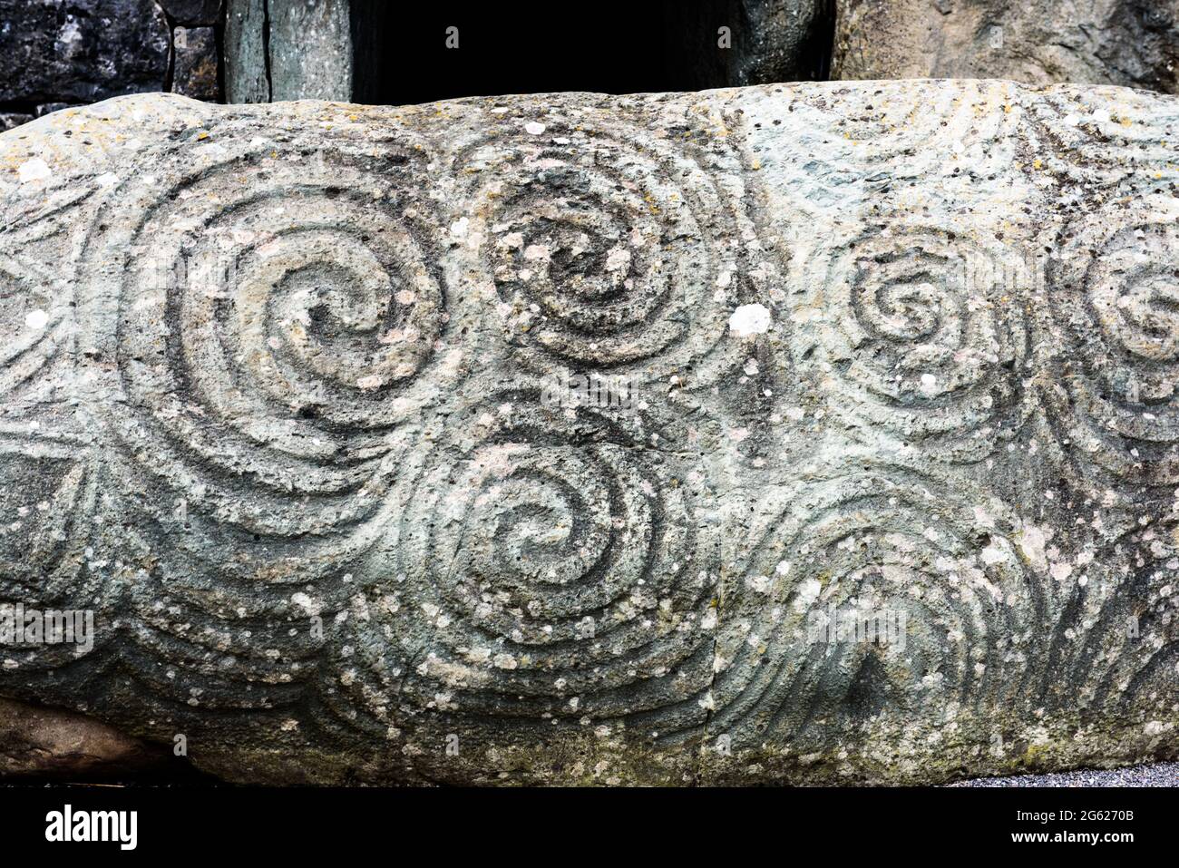 Tri spiral or triskell carved in a stone at the entrance of newgrange ...