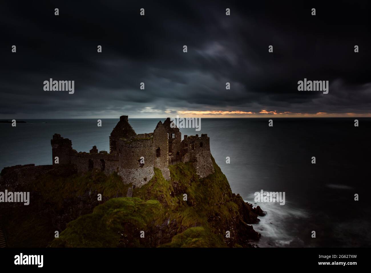 Dunluce castle by a cloudy evening Stock Photo - Alamy