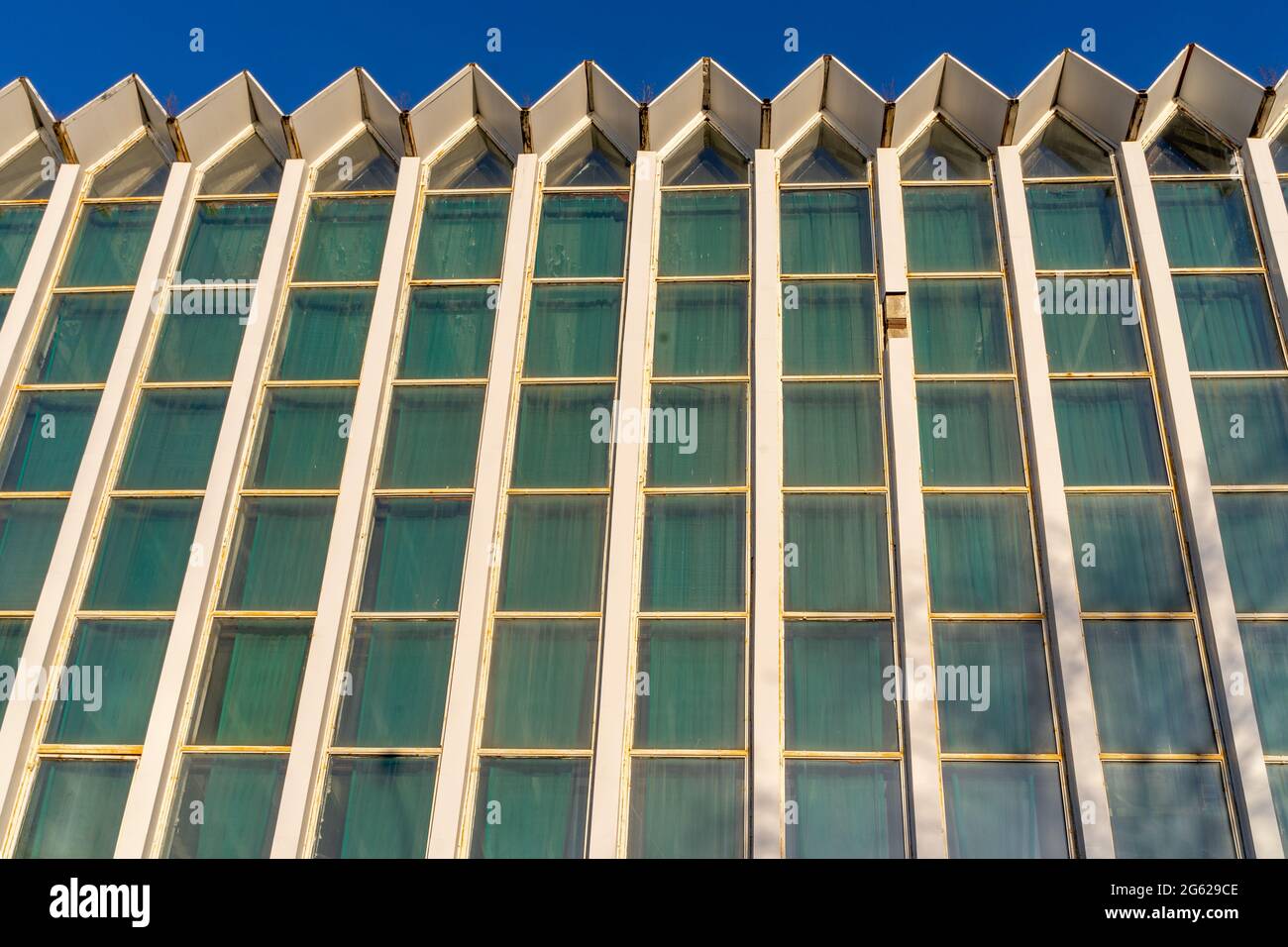 Glass wall and angled roof edge of Dolphinarium building, designed by ...