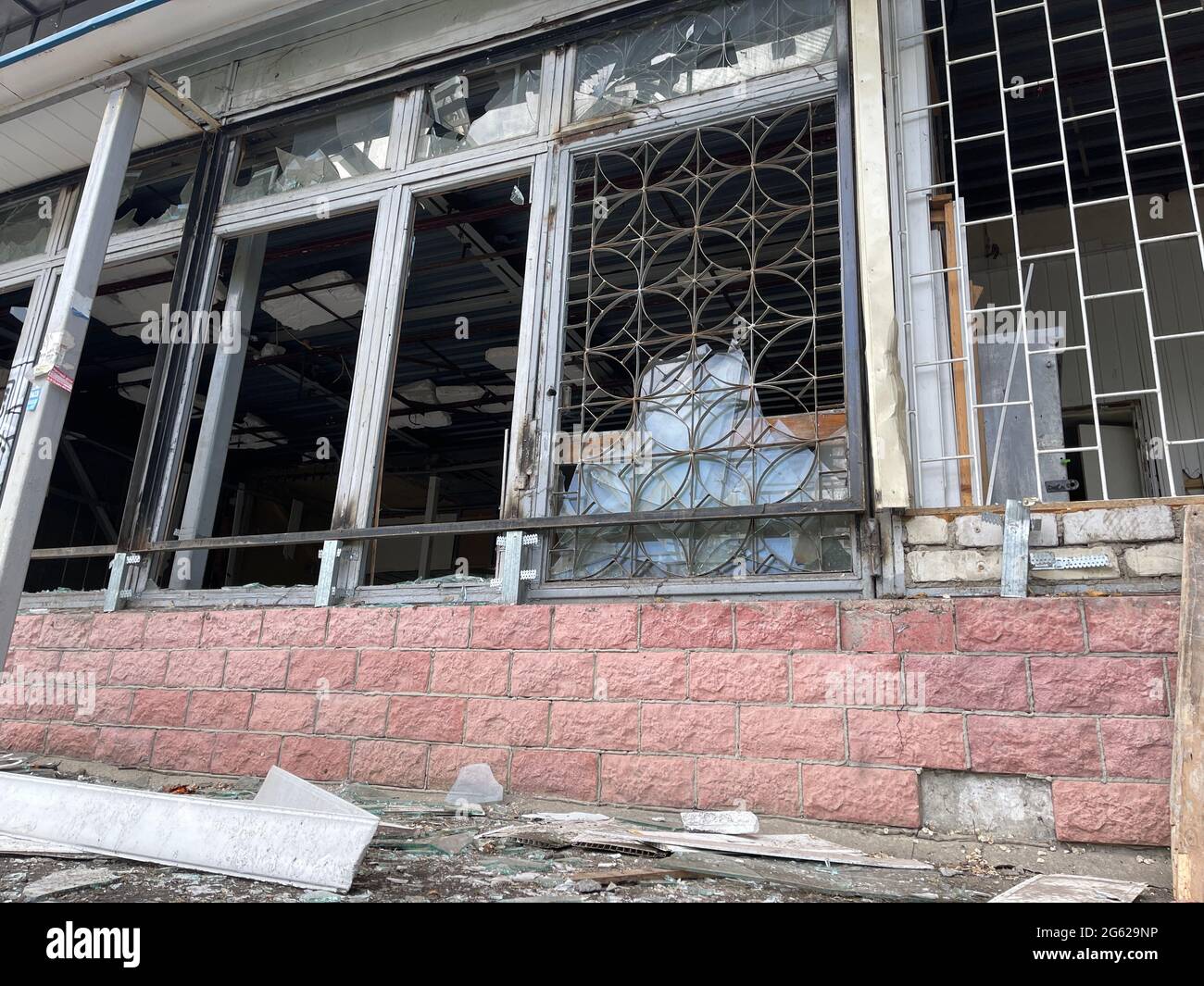 Close up of broken windows in old building. Windows with broken glasses ...
