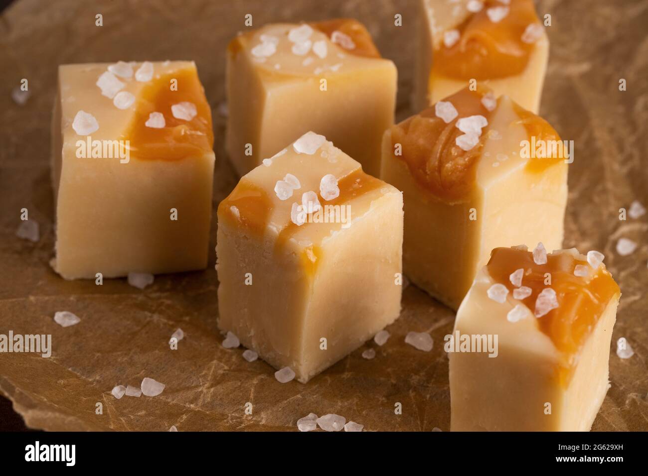 Sea Salt and Caramel Fudge on a Wooden Table with Baking Paper Stock ...