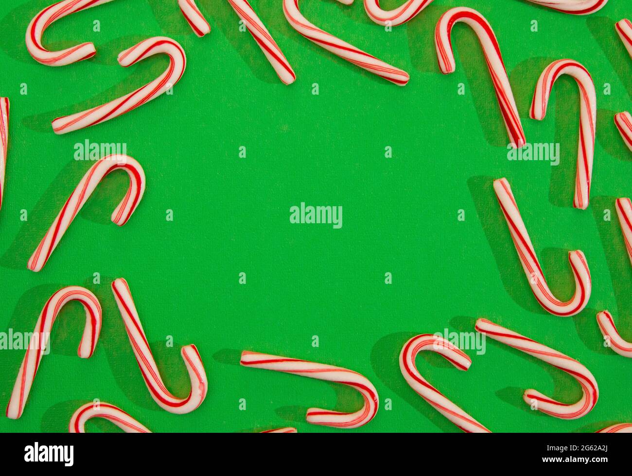 A Candy Cane Background on a Green Background Stock Photo - Alamy