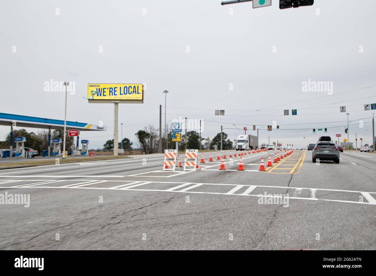 Augusta, Ga USA - 03 06 21: Traffic in an urban area with signs and ...