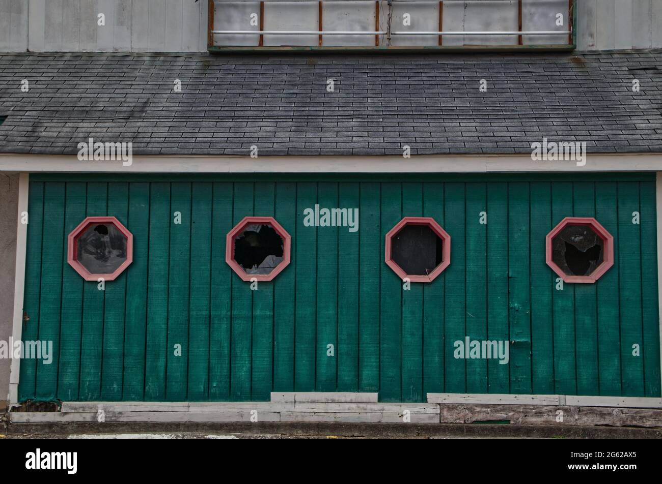 Old vintage textured wooden wall with busted out windows and weathered ...