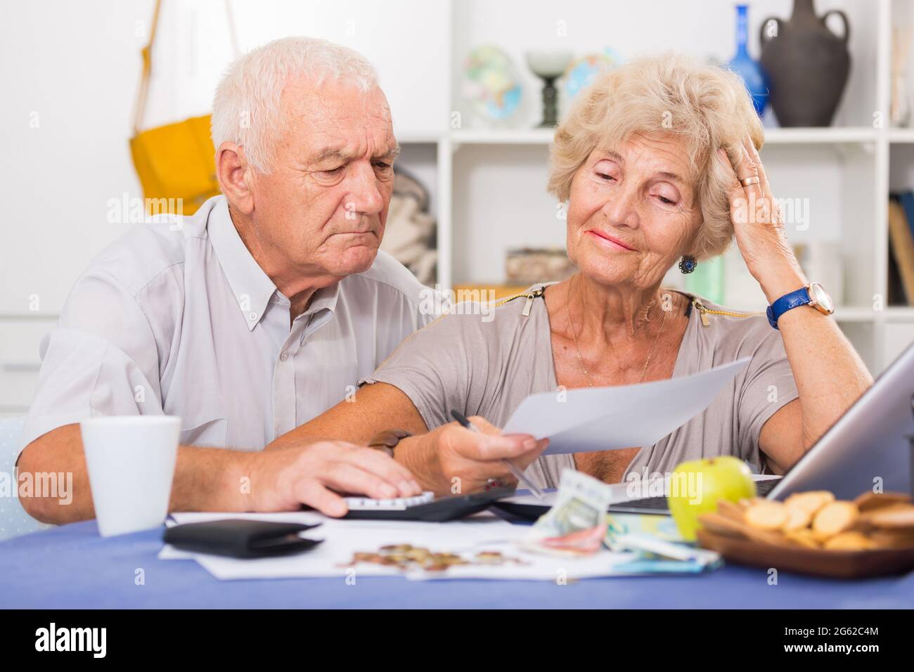 Frustrated senior couple faced financials troubles Stock Photo - Alamy