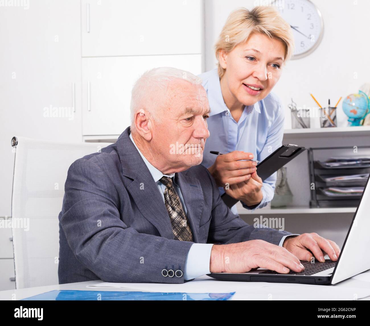 Female manager and male secretary hi-res stock photography and images ...