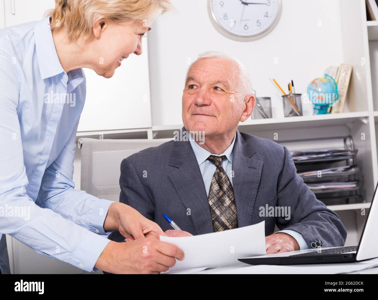 Manager and secretary working Stock Photo - Alamy