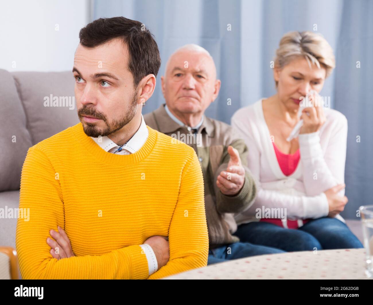 Parents arguing with son Stock Photo - Alamy